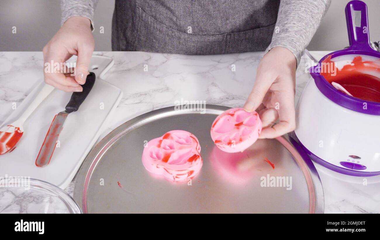 Step by step. Making chocolate hearts and kisses from melted red ...