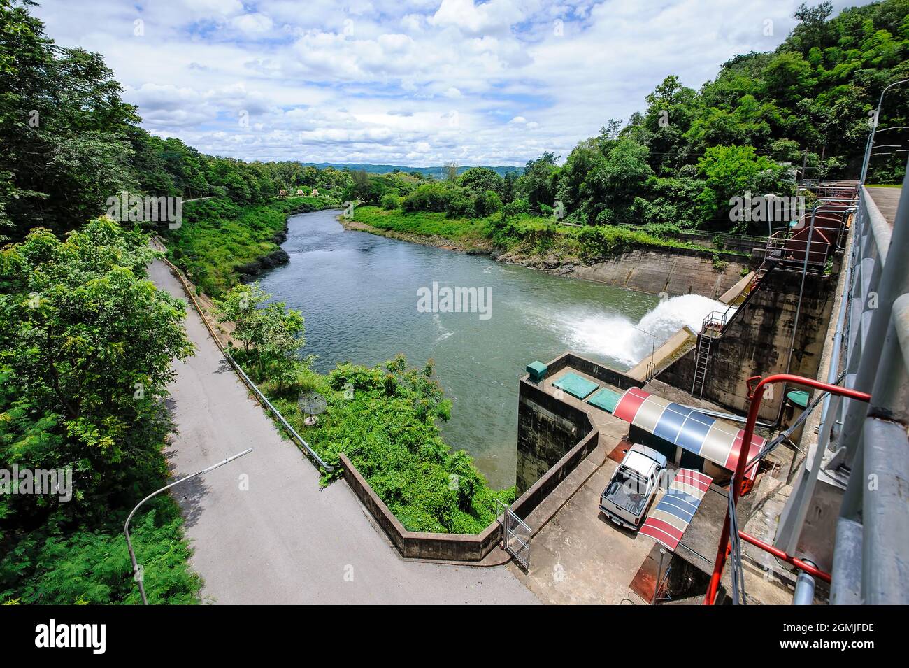 power generator plant dam with green trees in cloudy sky Stock Photo ...