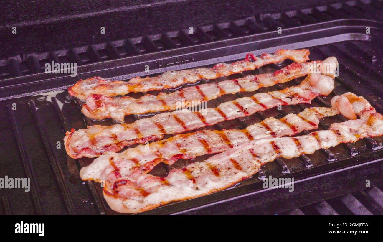 Cooking bacon stips on hi-res stock photography and images - Alamy