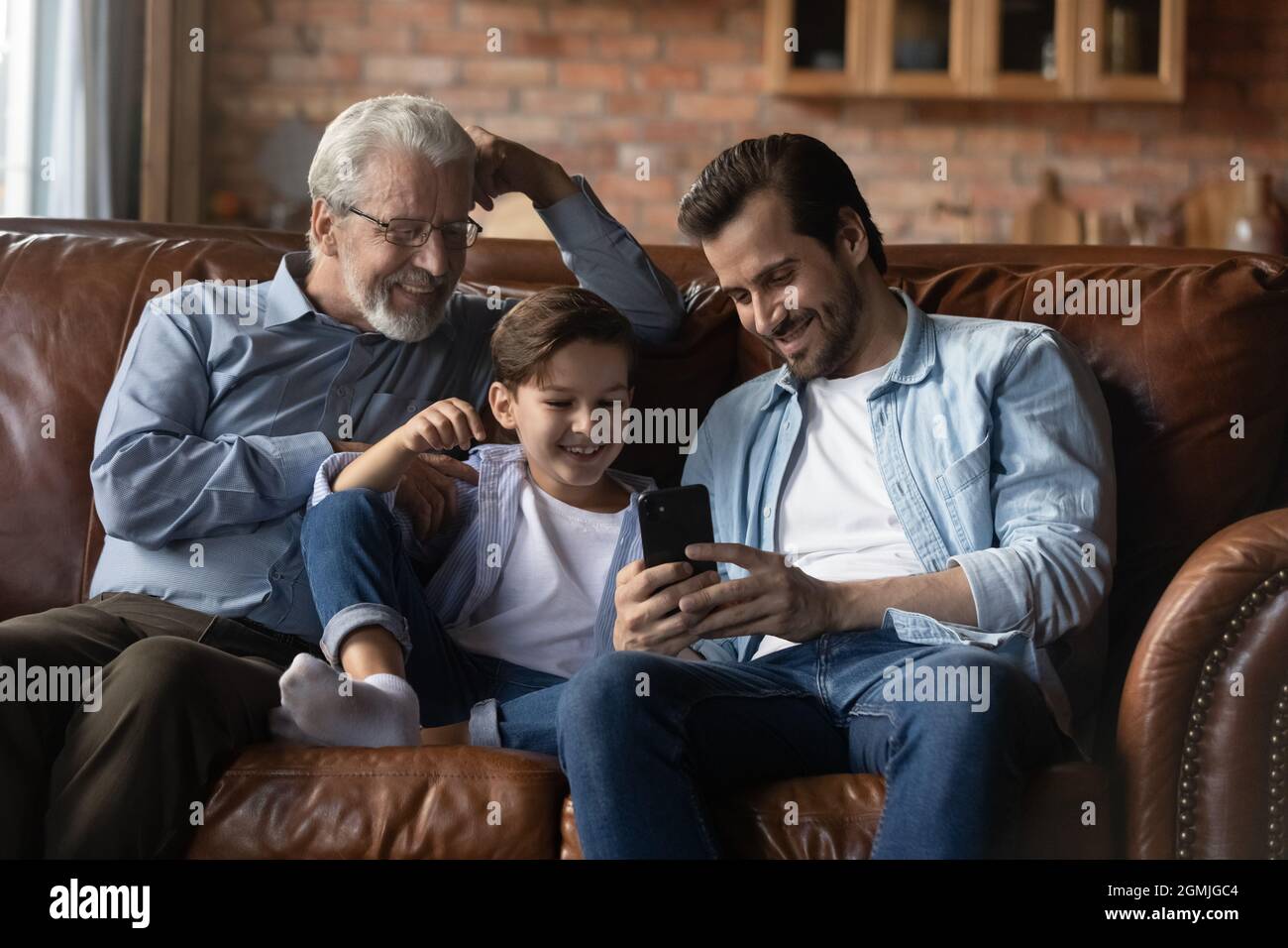 Three generations of men hi-res stock photography and images - Alamy