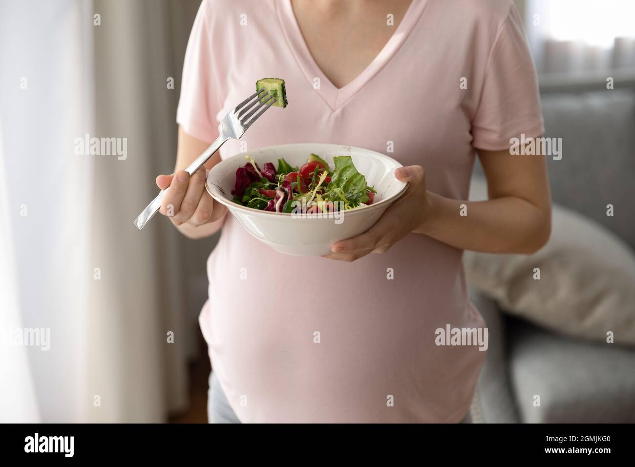 Woman expecting baby eating vegetable salad fresh healthy food Stock ...