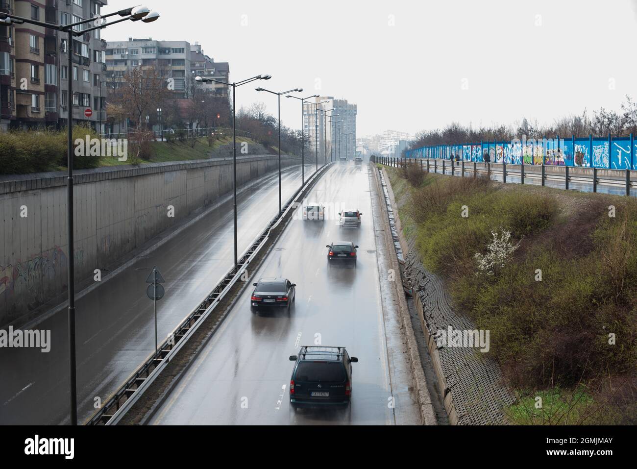Cars driving in the rain in Sofia Bulgaria Stock Photo - Alamy