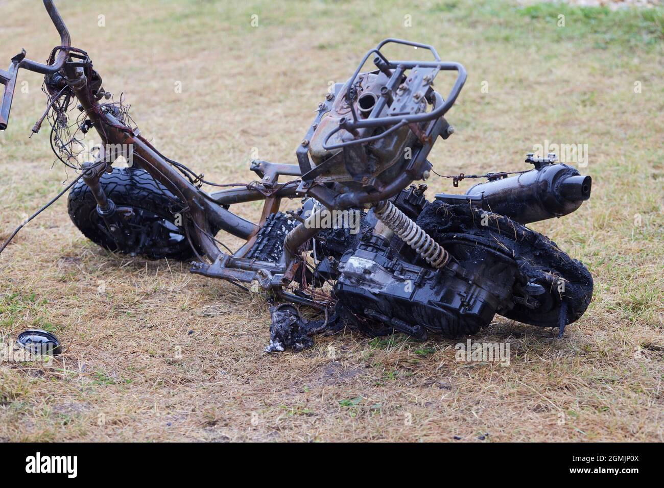 Burnt out motorcycle seen on a lawn Stock Photo - Alamy