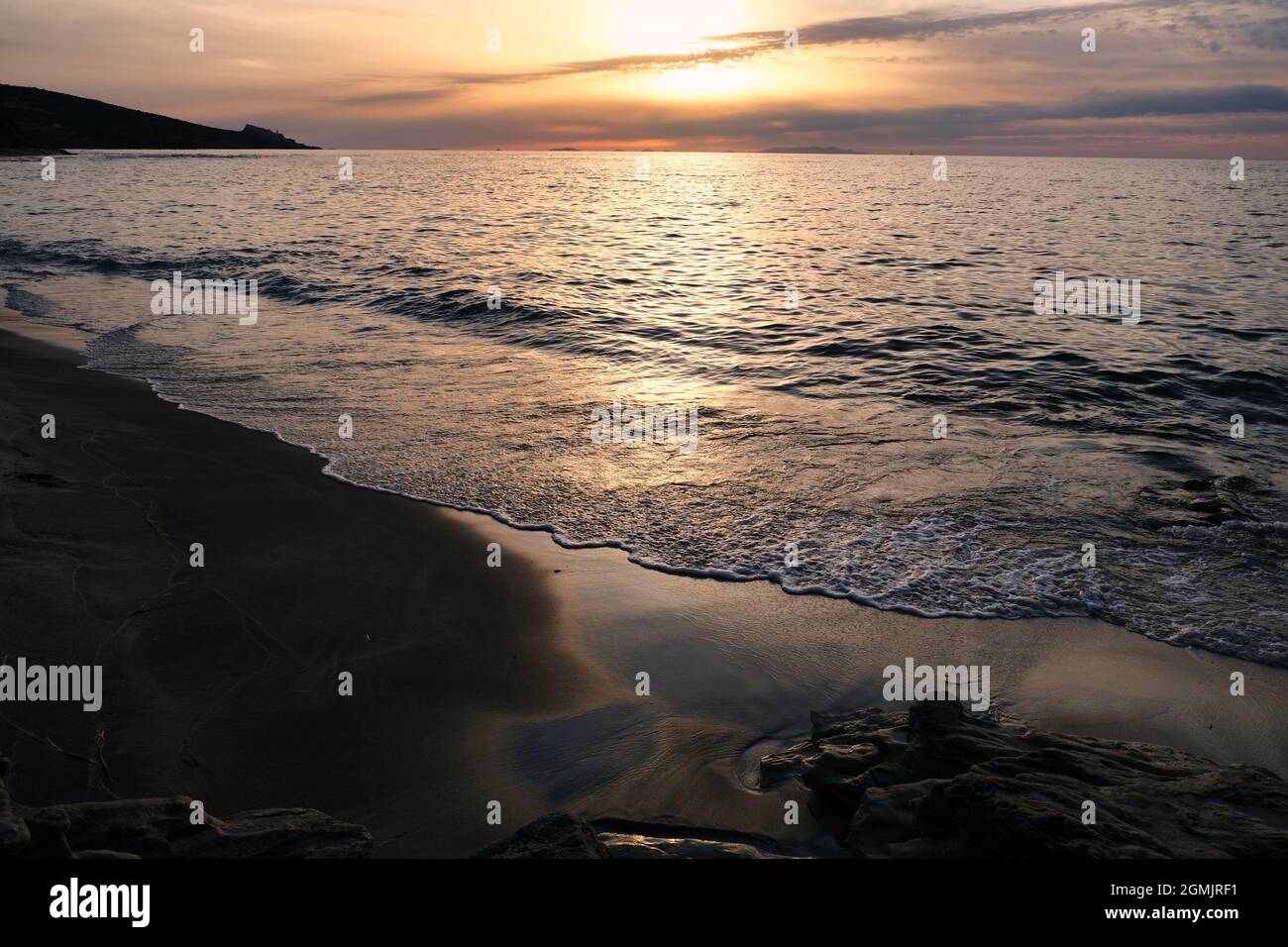 Sunset on the beach Stock Photo - Alamy