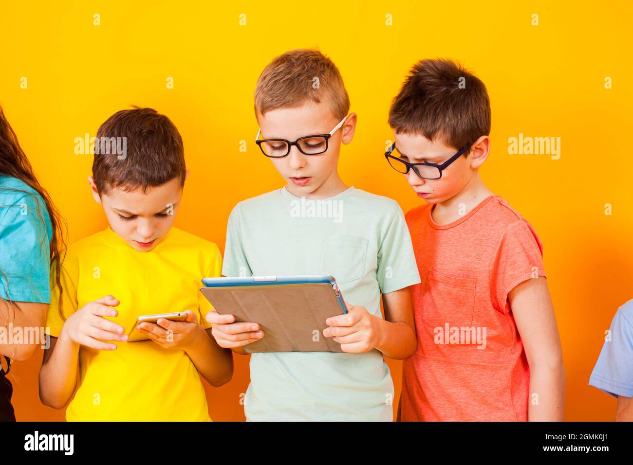 Young kids playing game on mobile phone Stock Photo - Alamy