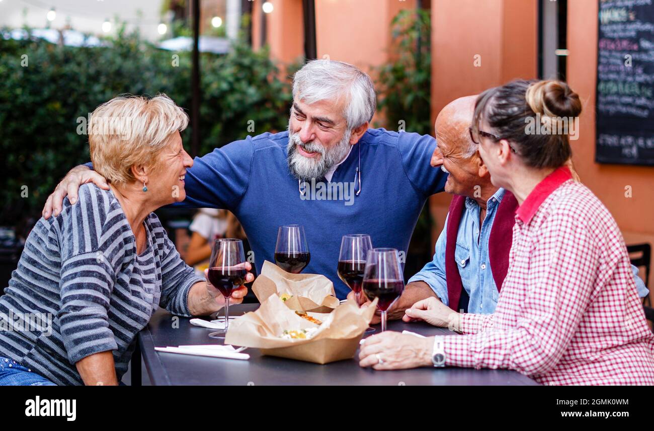 Group of old people eating and drinking outdoor - Seniors having fun ...