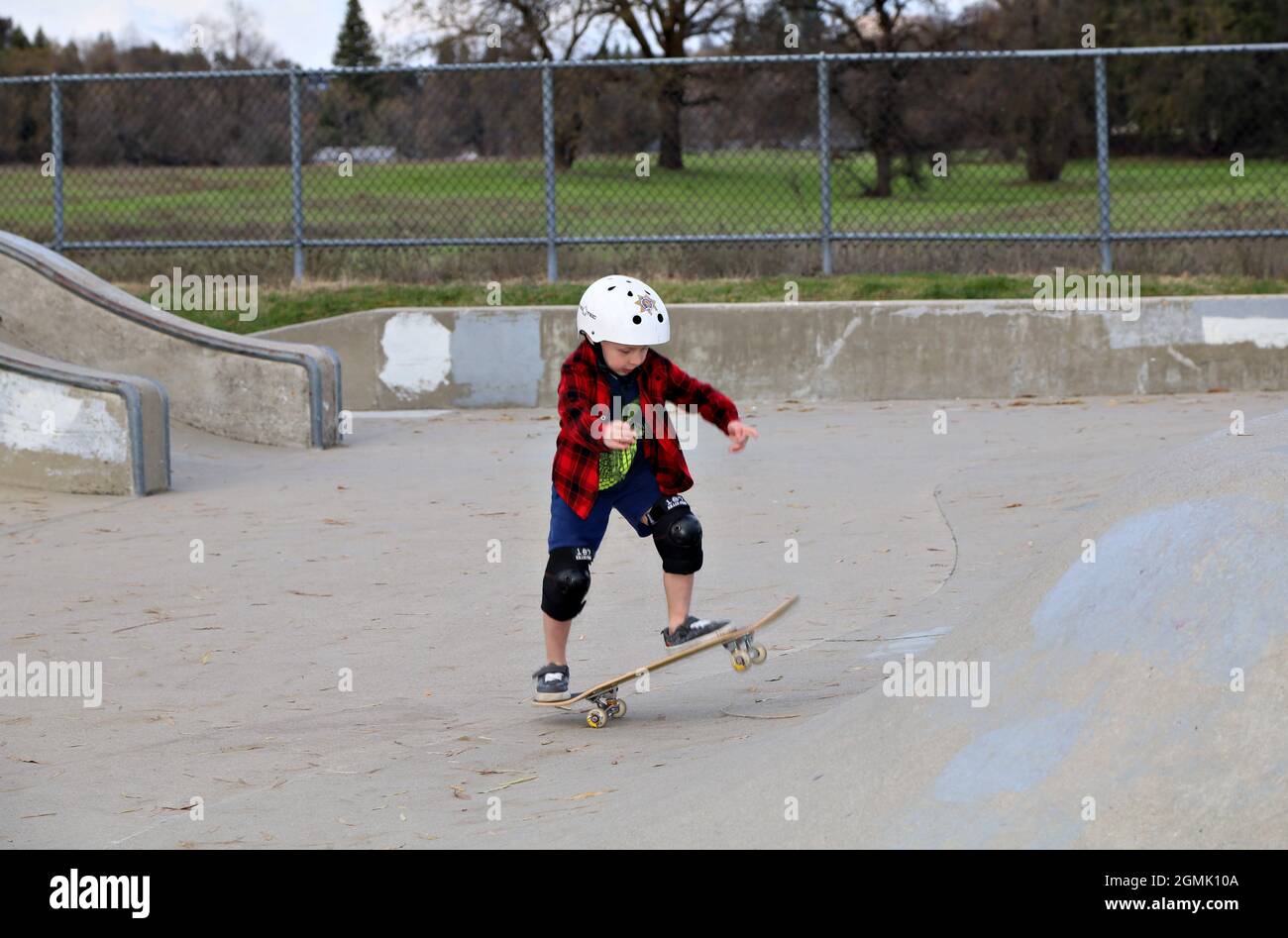 Little Skateboarders at skate park Stock Photo - Alamy
