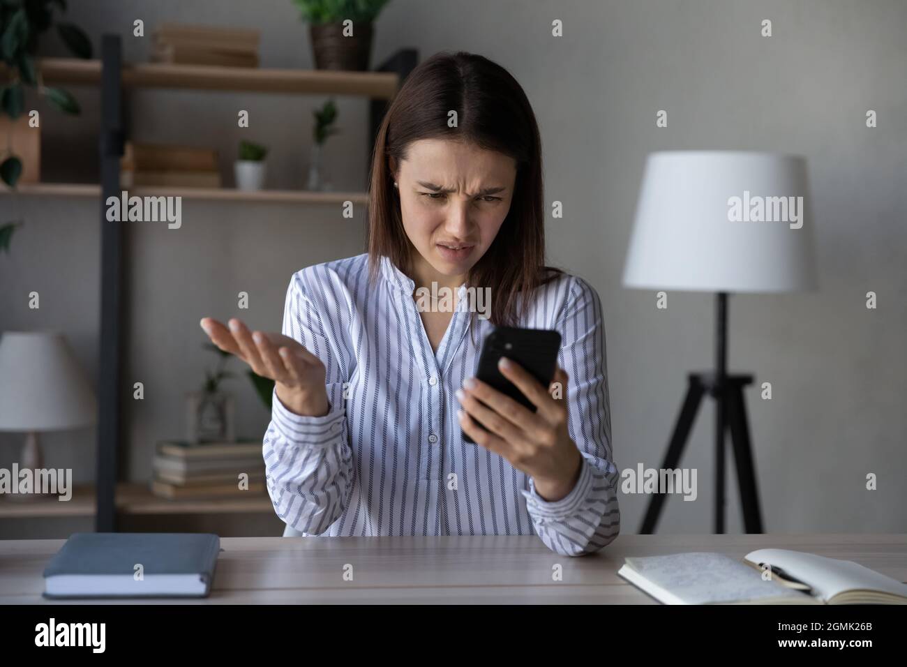 Frustrated office woman texting hi-res stock photography and images - Alamy