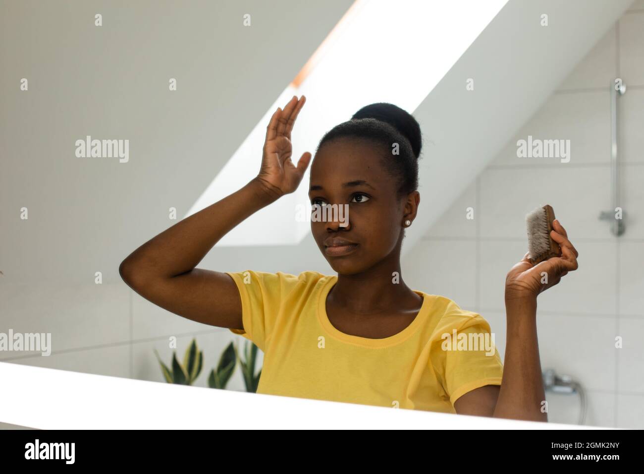Everyday hair care routines for african girl Stock Photo - Alamy