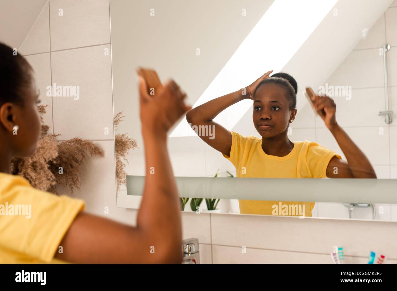 Everyday hair care routines for african girl Stock Photo - Alamy
