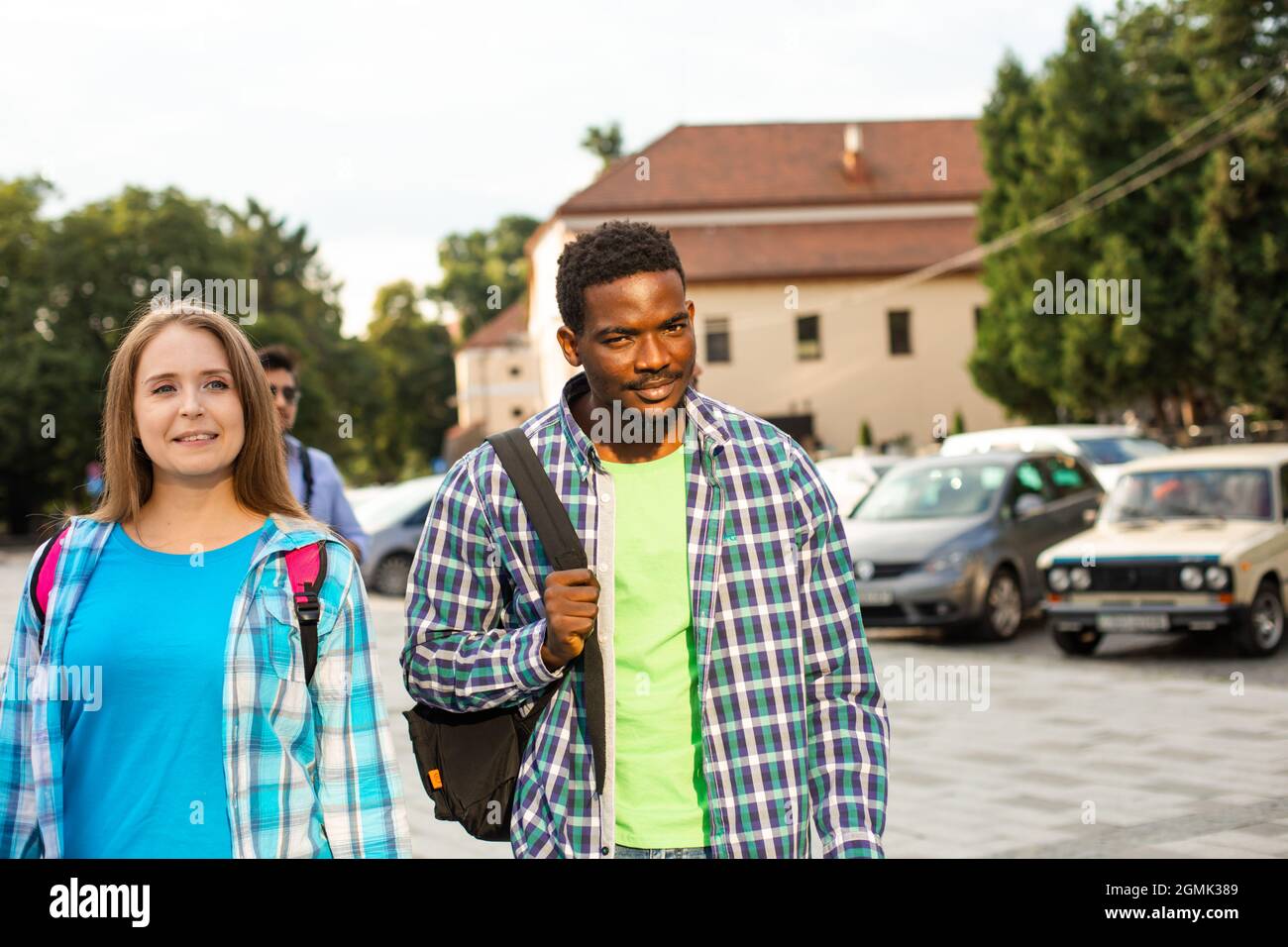 Smiling man walking backpacks hi-res stock photography and images - Alamy