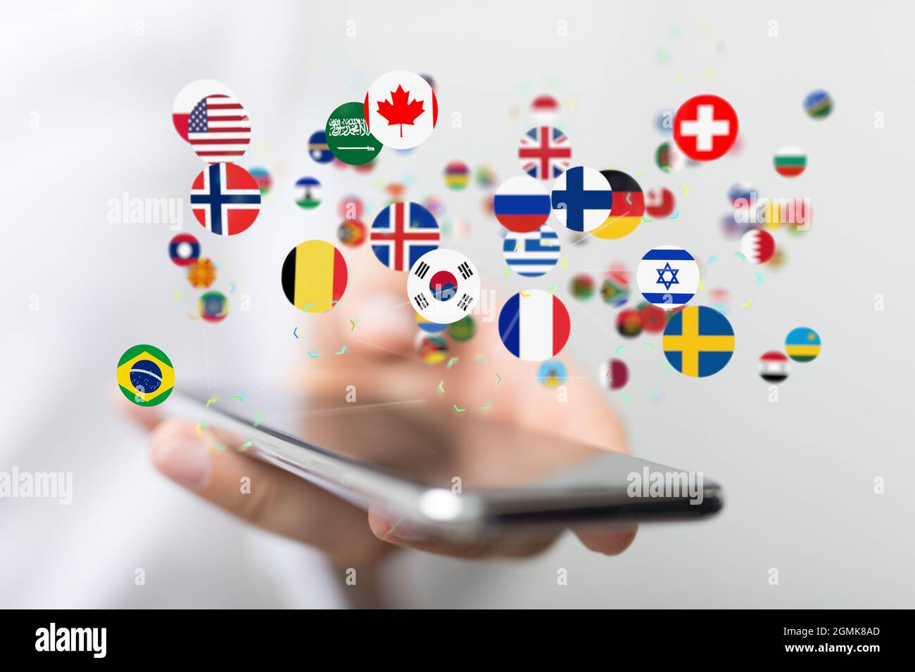 A 3D rendering of National flags of the world on a hand holding a ...