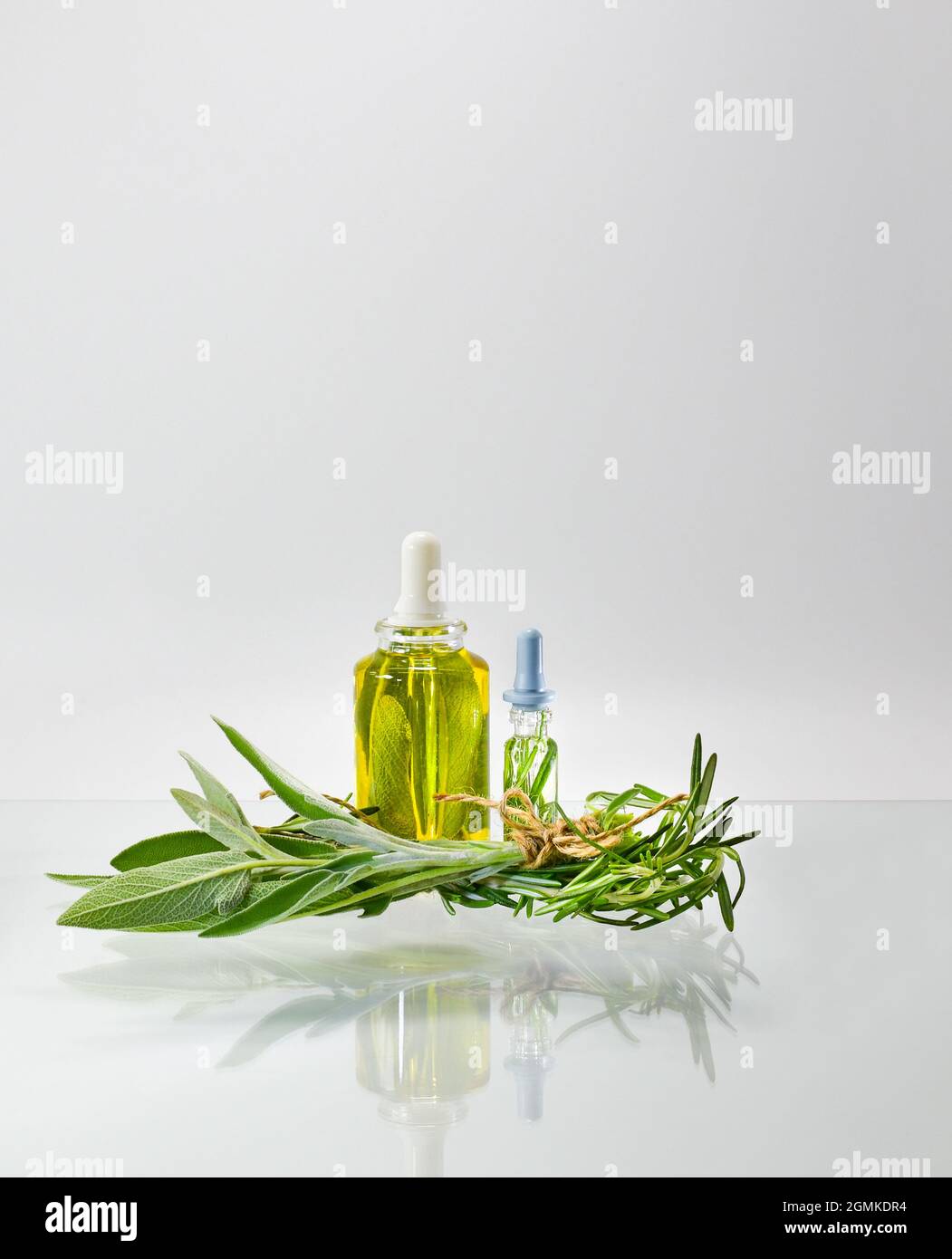 Two types of herbal extract in glass bottles with pipette dispensers ...