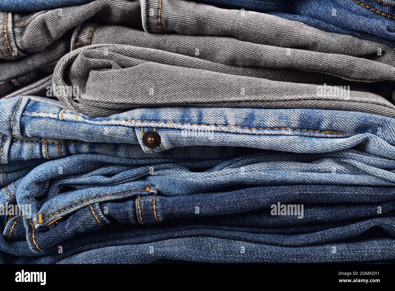 close up different color folded jeans, jeans texture background Stock ...