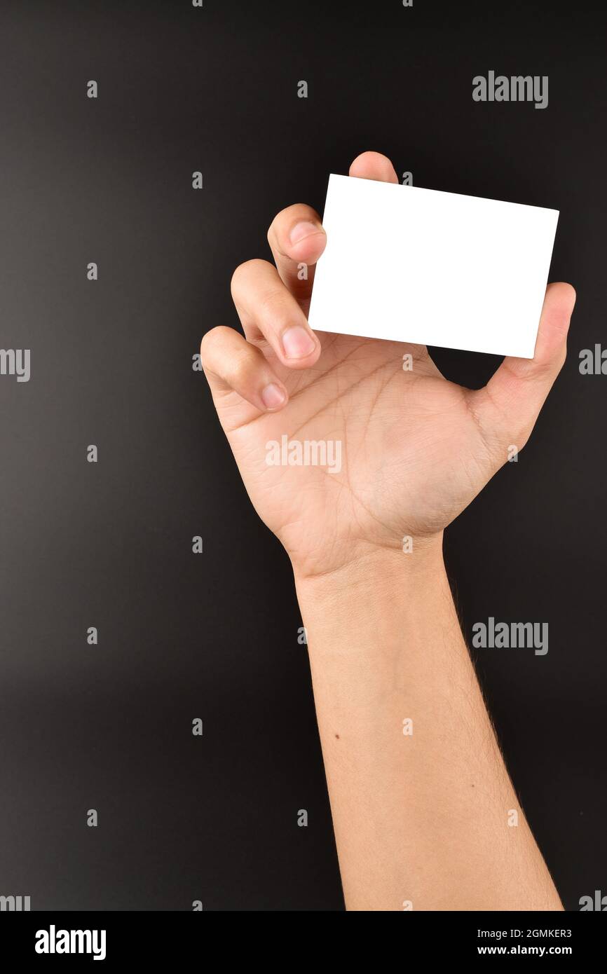 hand showing blank card for message and text over dark background Stock ...