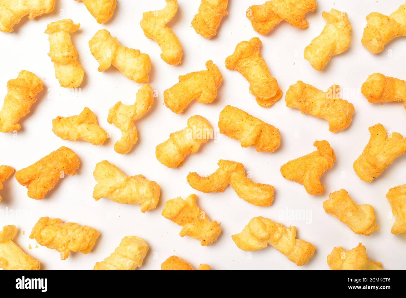 cheese corn puff chips over white background Stock Photo - Alamy