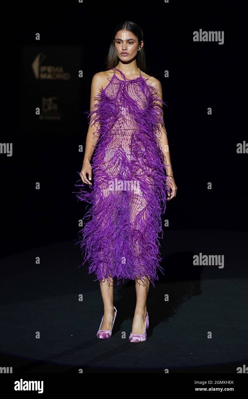 Madrid, Spain. 19th Sep, 2021. A model walks the runway at the ...