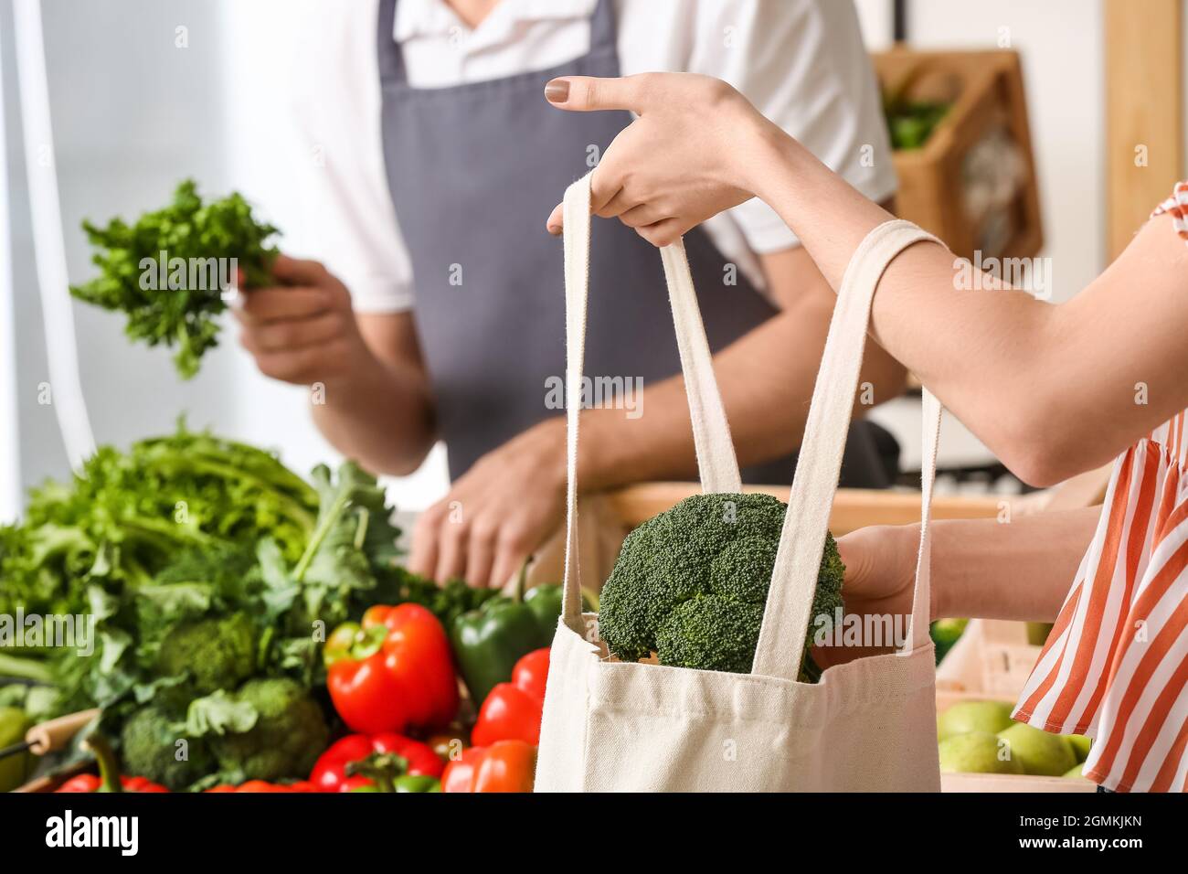 Woman buying fresh green herbs hi-res stock photography and images - Alamy