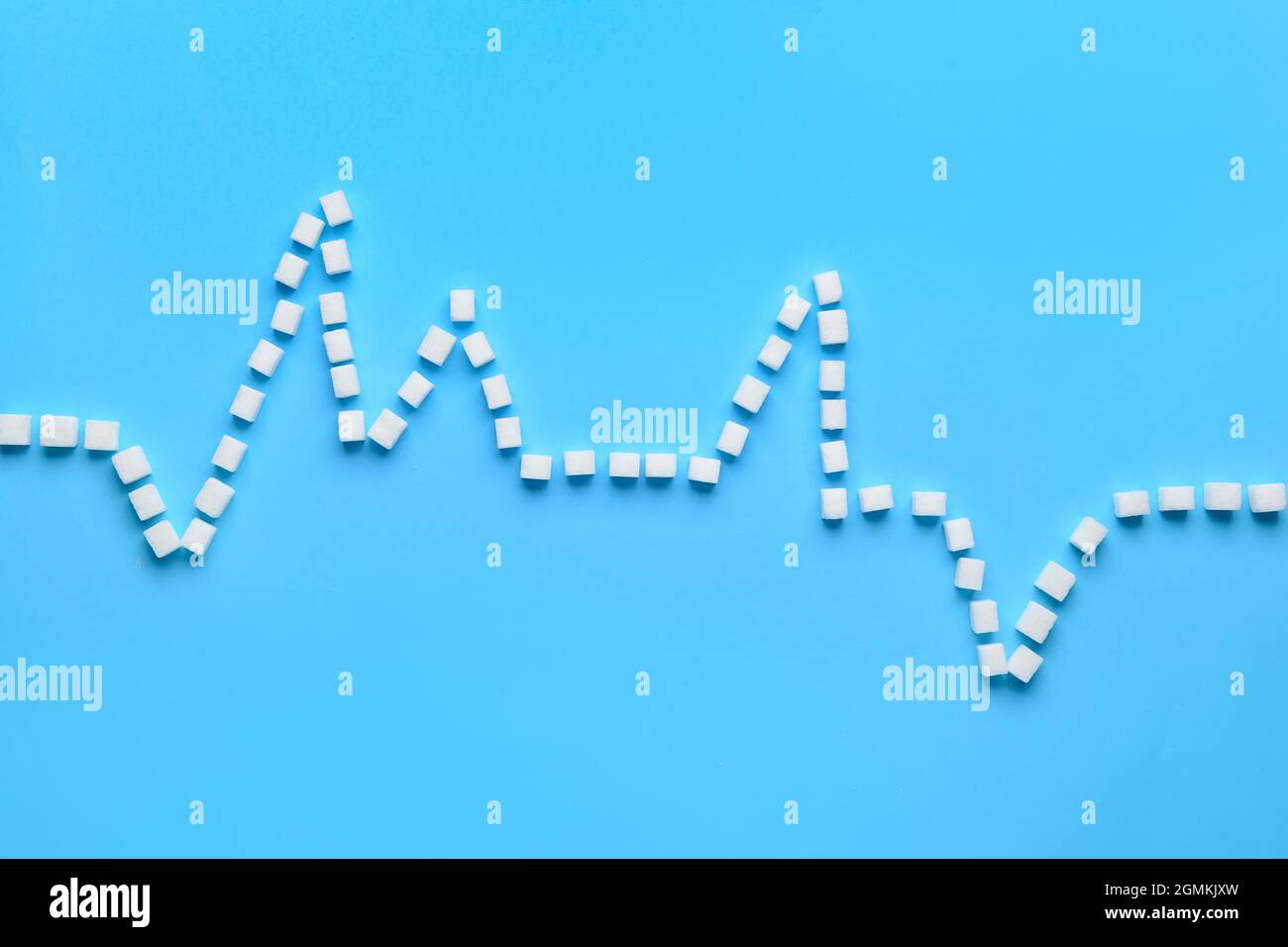 Cardiogram made of sugar on color background Stock Photo - Alamy