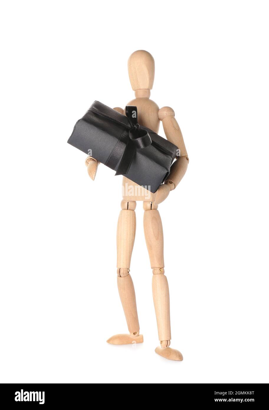 Wooden mannequin with gift box on white background Stock Photo - Alamy