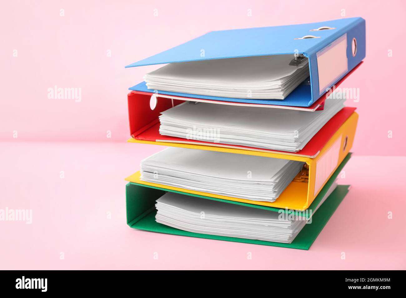Office folders on color background Stock Photo - Alamy