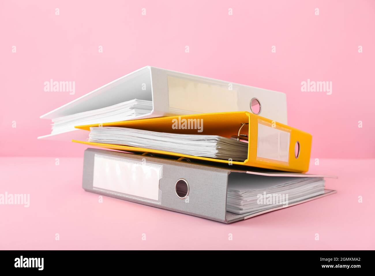 Office folders on color background Stock Photo - Alamy