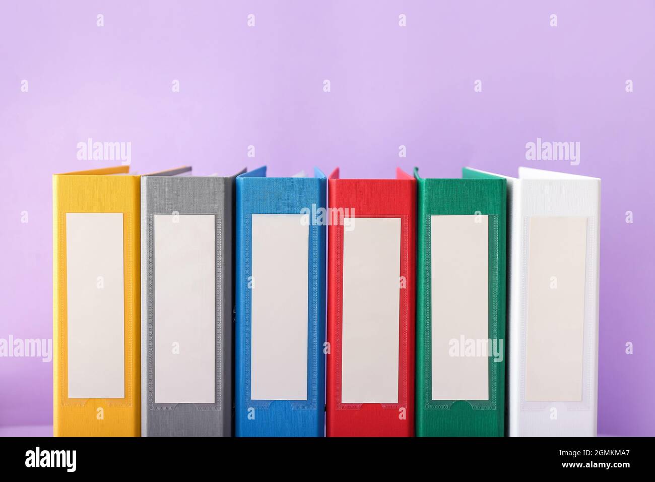 Office folders on color background Stock Photo - Alamy