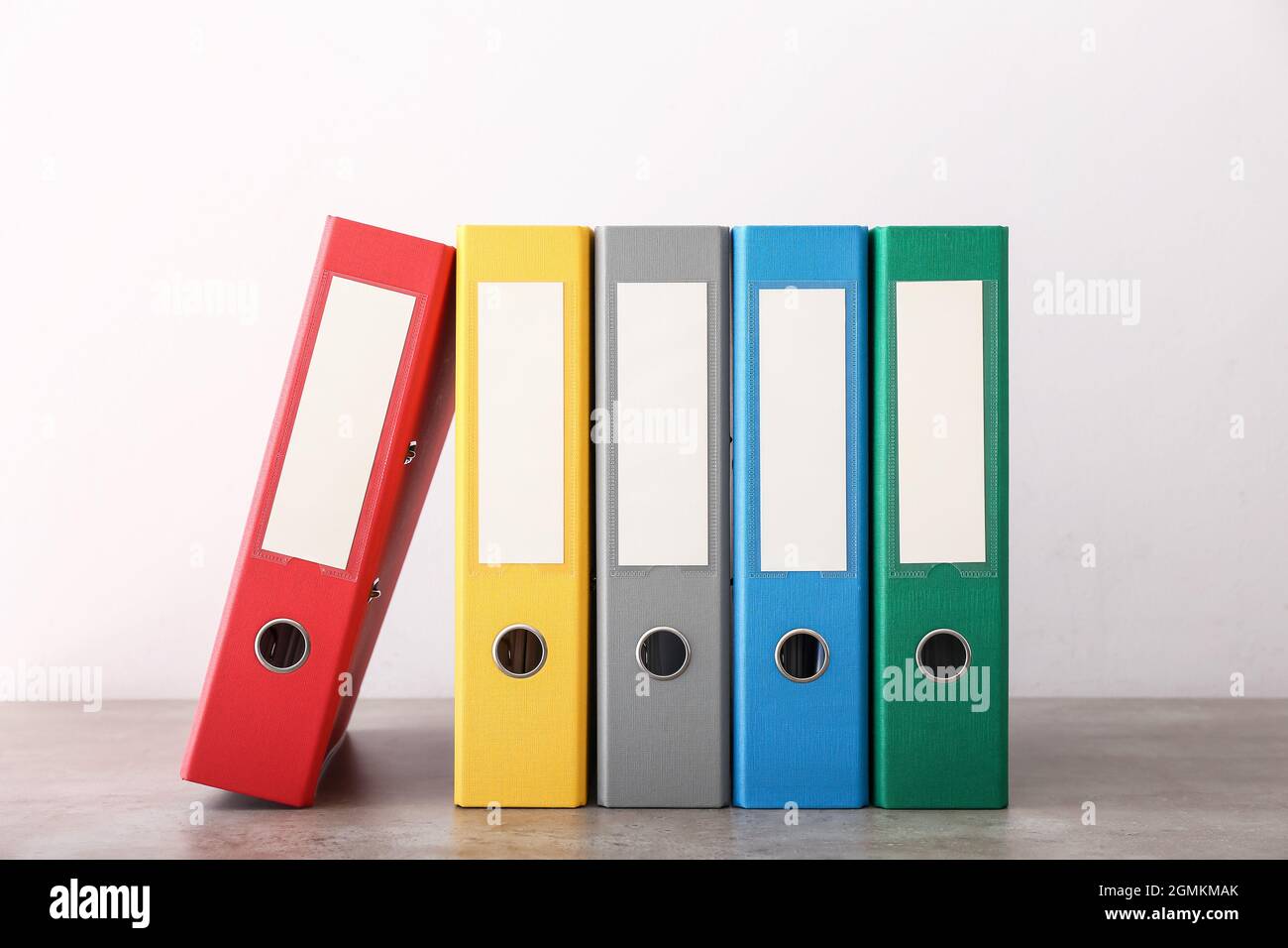 Office folders on light background Stock Photo - Alamy