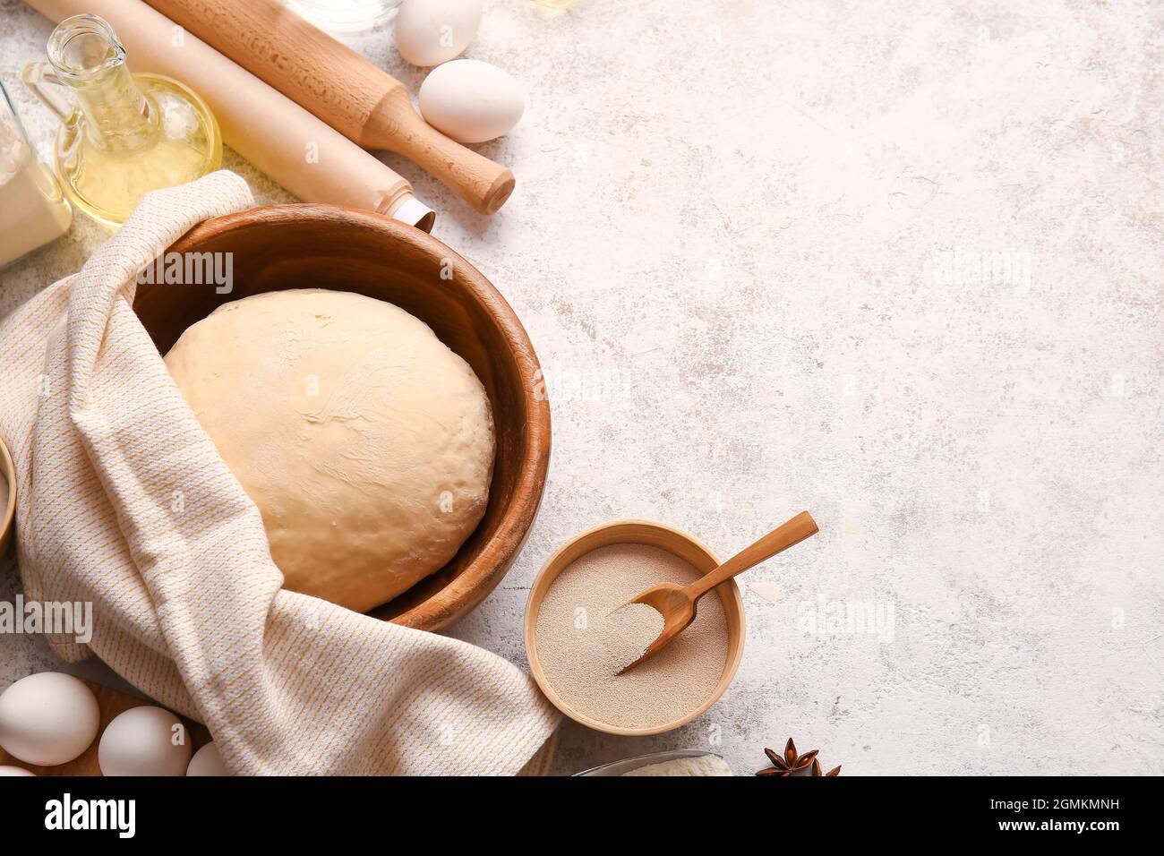 Composition with fresh dough on light background Stock Photo - Alamy