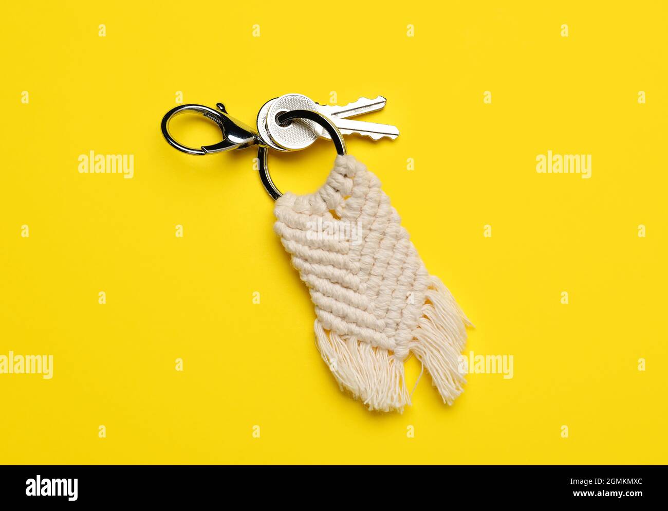 Keys with handmade cotton keychain on color background Stock Photo - Alamy
