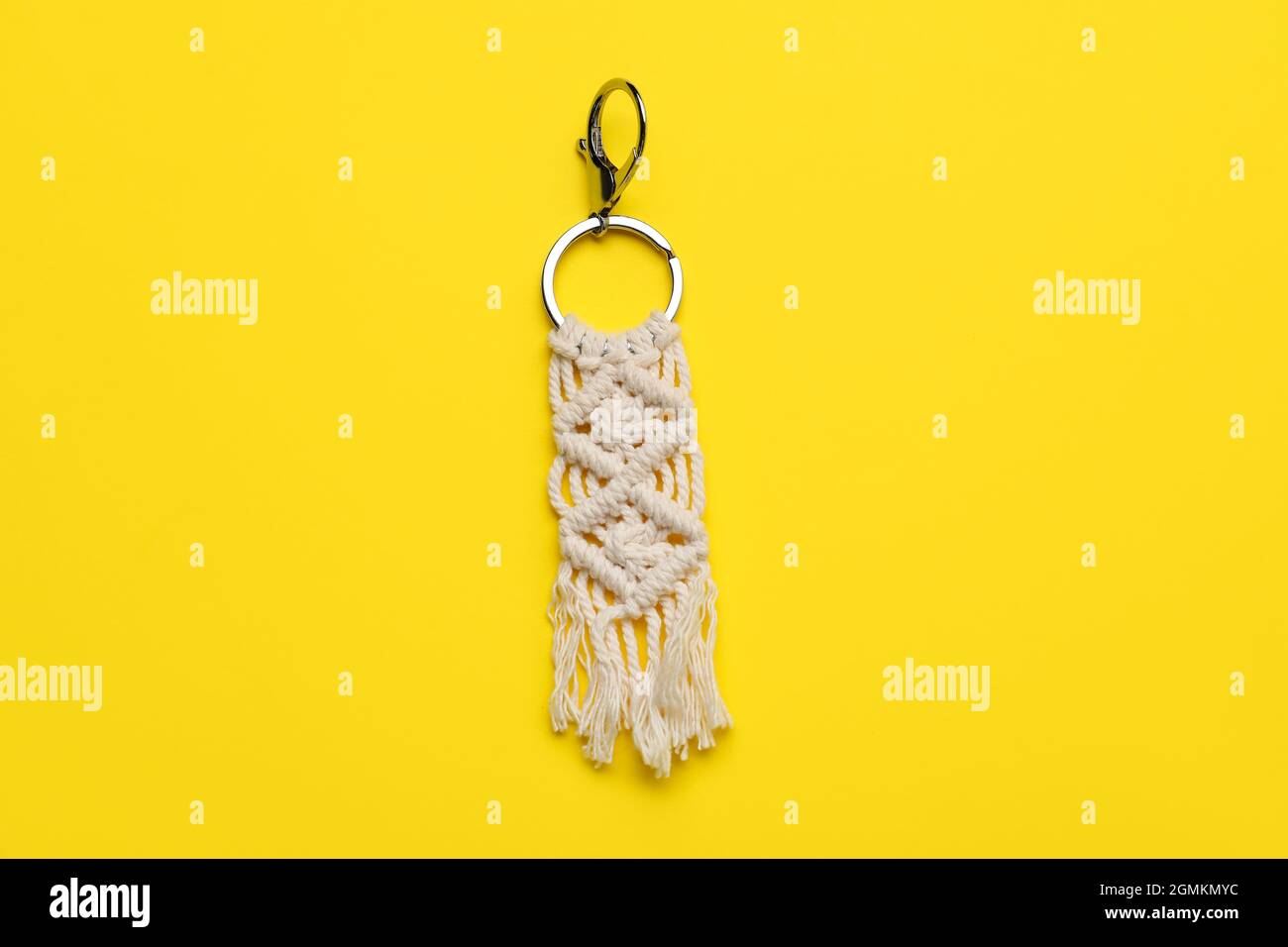 Handmade cotton keychain on color background Stock Photo - Alamy