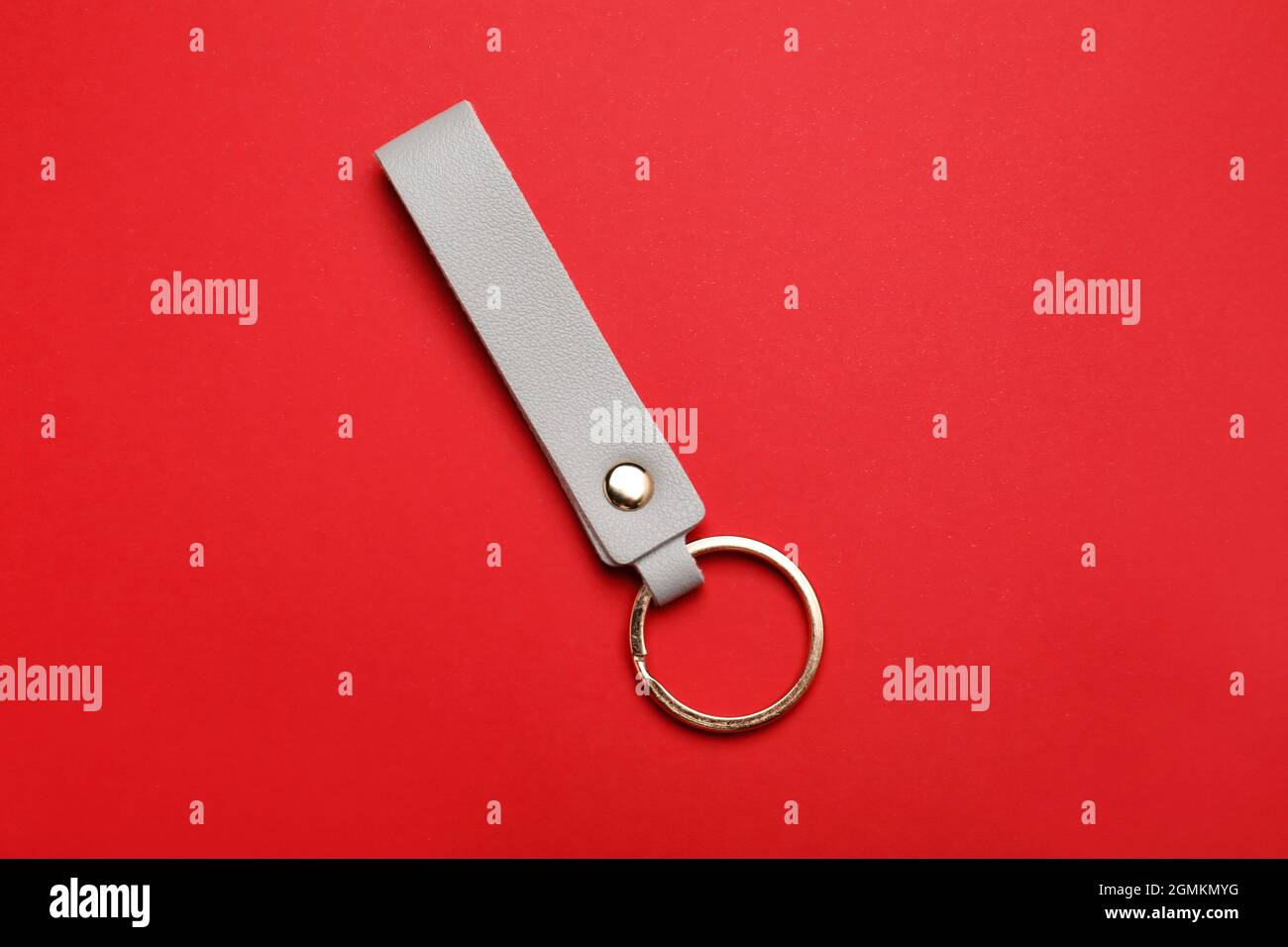 Leather keychain on color background Stock Photo - Alamy