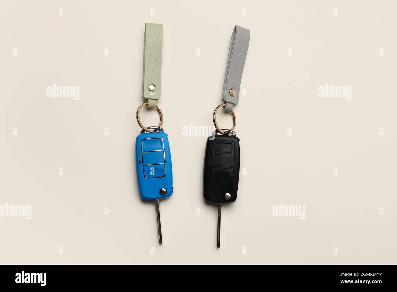 Car keys with leather keychains on light background Stock Photo - Alamy