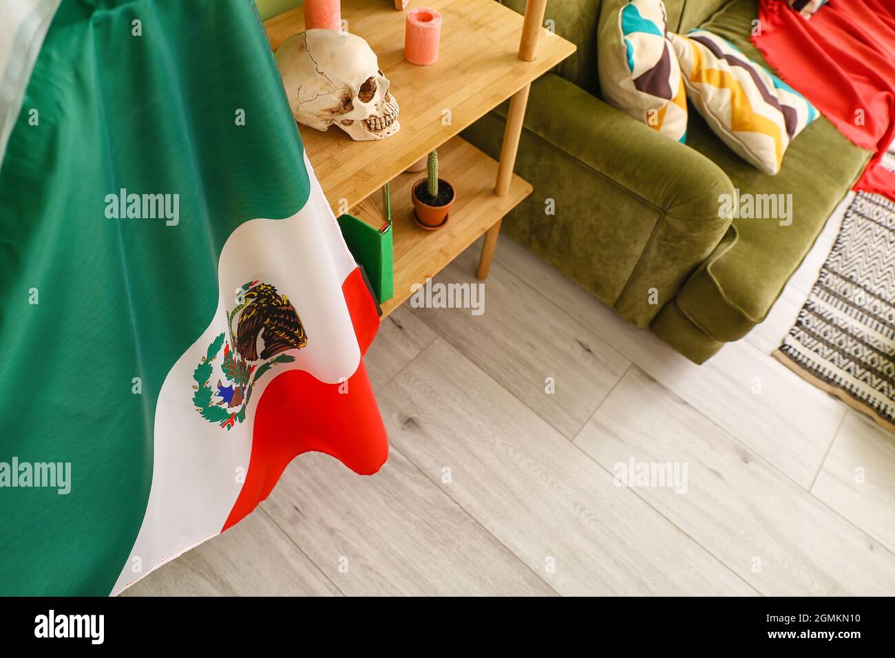 Book shelf with decor and Mexican flag in room Stock Photo - Alamy