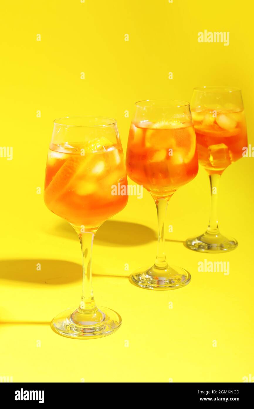 Glasses of Aperol spritz cocktail on color background Stock Photo - Alamy