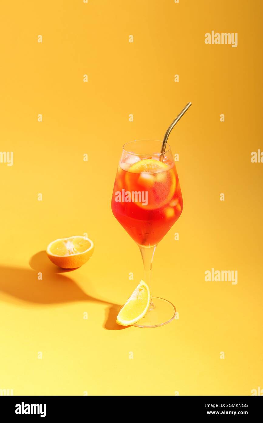 Glass of Aperol spritz cocktail on color background Stock Photo - Alamy