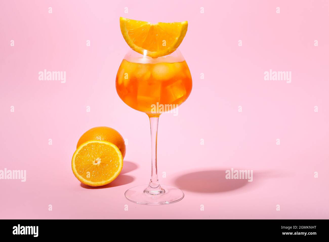 Glass of Aperol spritz cocktail on color background Stock Photo - Alamy