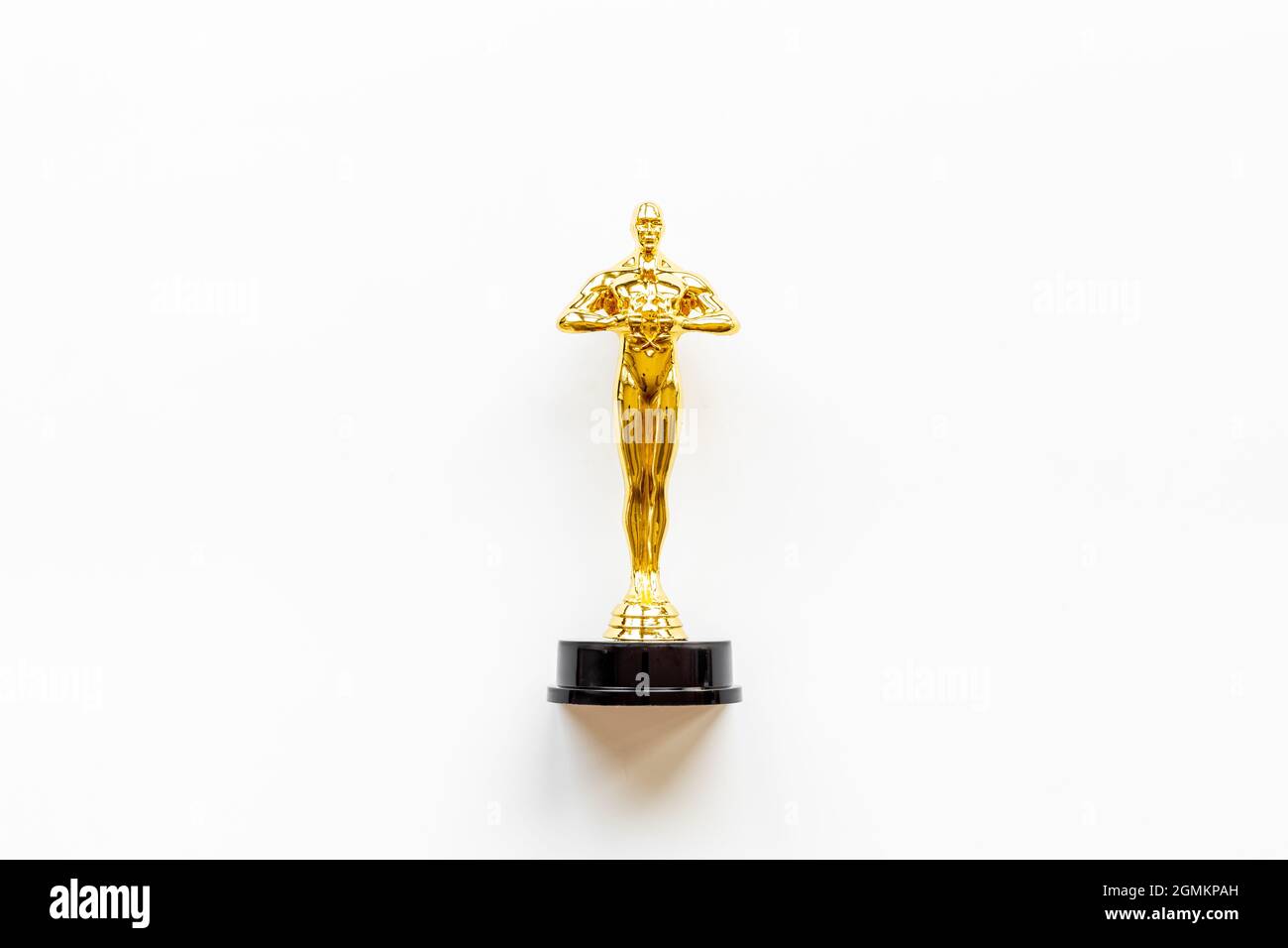 Golden film award statue - winner of movie industry Stock Photo - Alamy