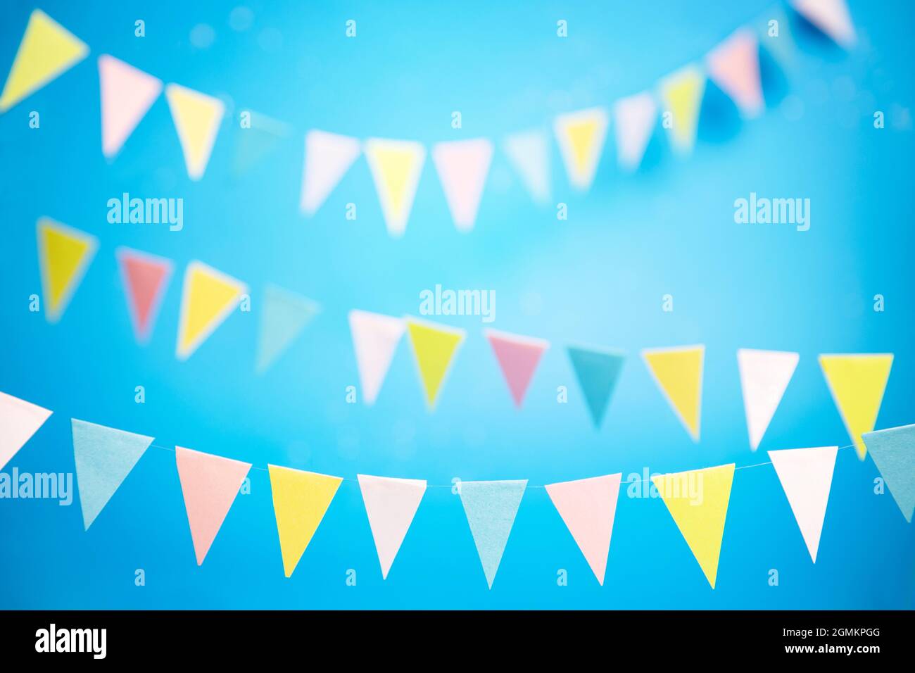 Colorful party flags over blue background Stock Photo - Alamy