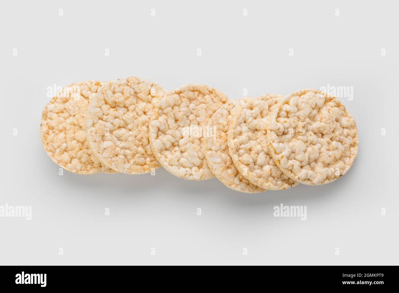Crispy rice crackers on white background Stock Photo - Alamy