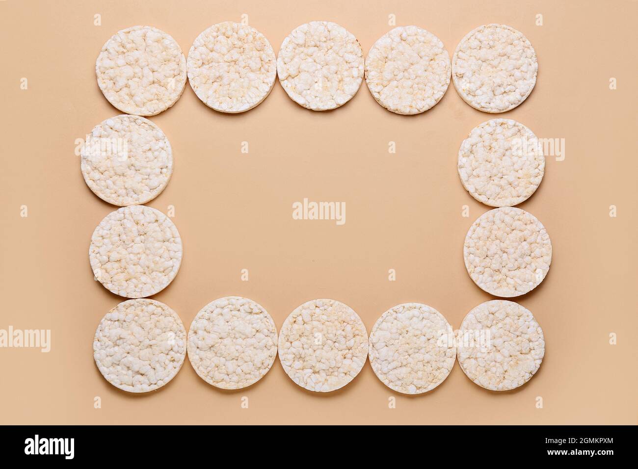 Frame made of puffed rice crackers on color background Stock Photo - Alamy