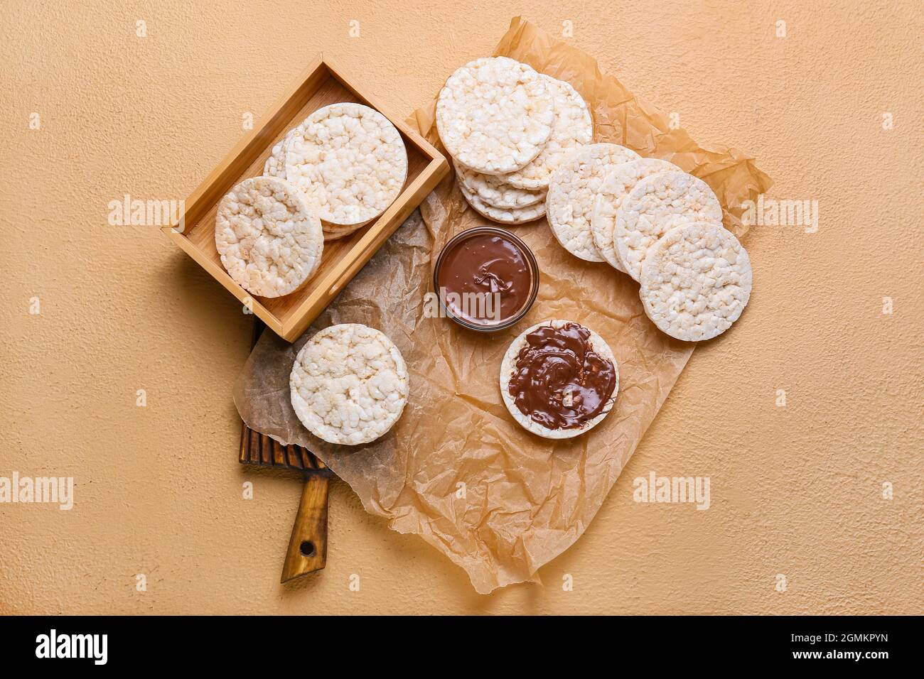 Composition with puffed rice crackers and melted chocolate on color ...