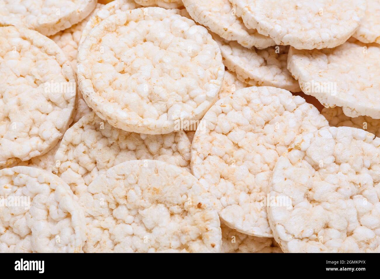 Puffed crispy rice crackers, closeup Stock Photo - Alamy