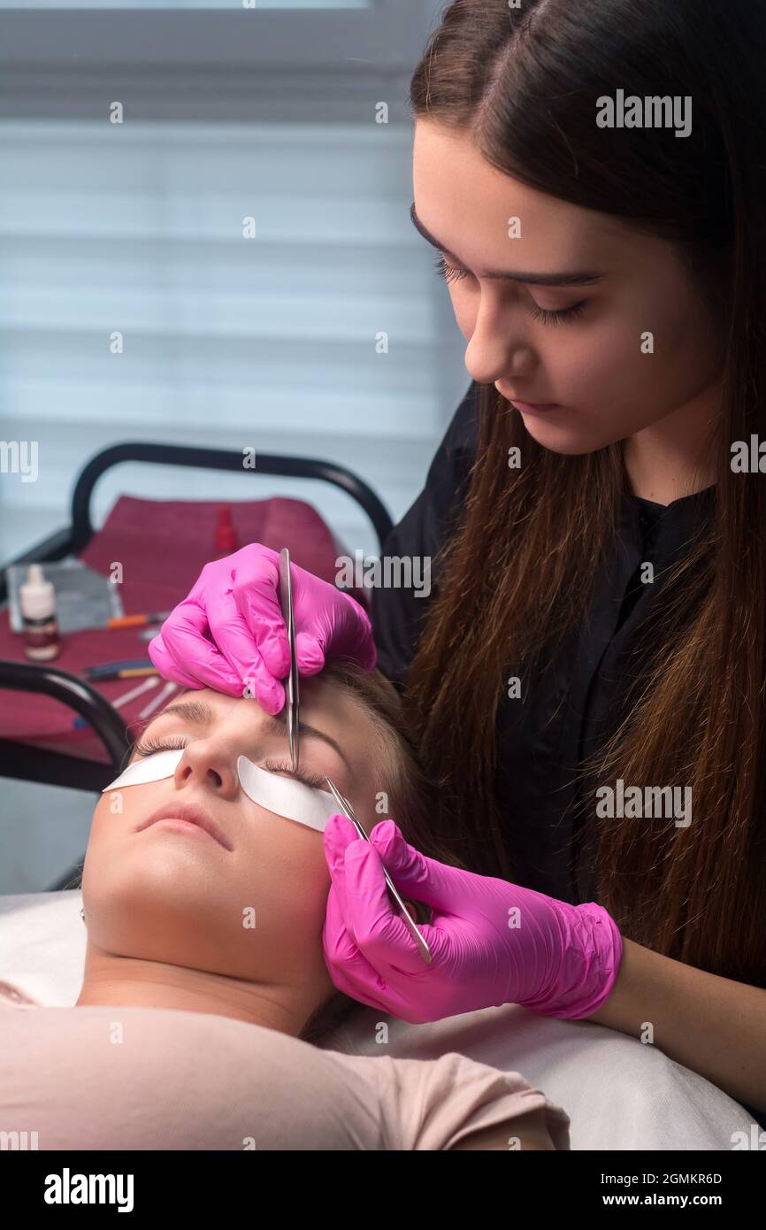 Eyelash extension procedure hi-res stock photography and images - Alamy