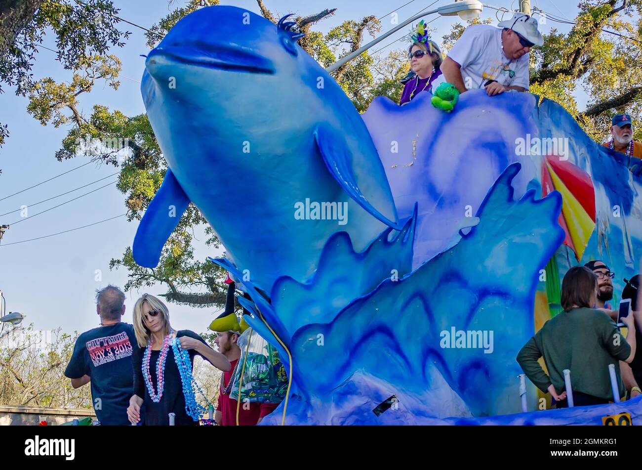 A Mardi Gras float features a dolphin theme during the Joe Cain Day ...