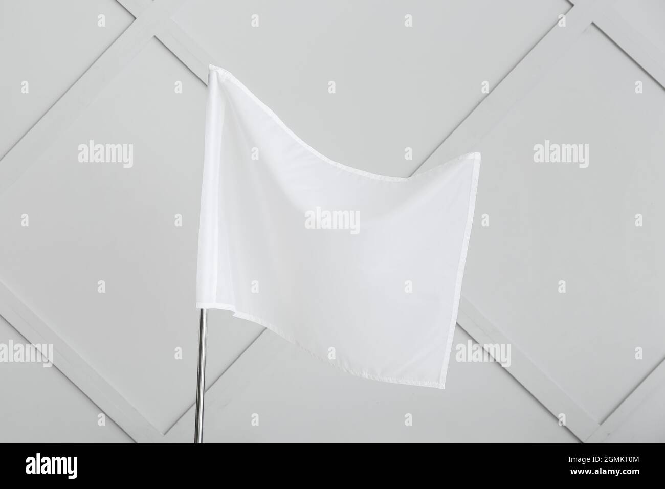White flag on light background Stock Photo - Alamy