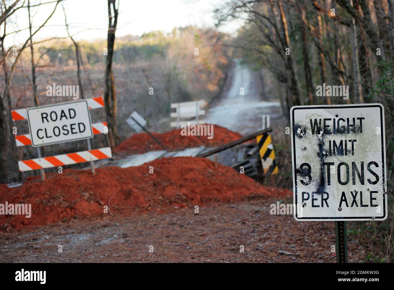 Destroyed wooden bridge with warning signs Stock Photo - Alamy