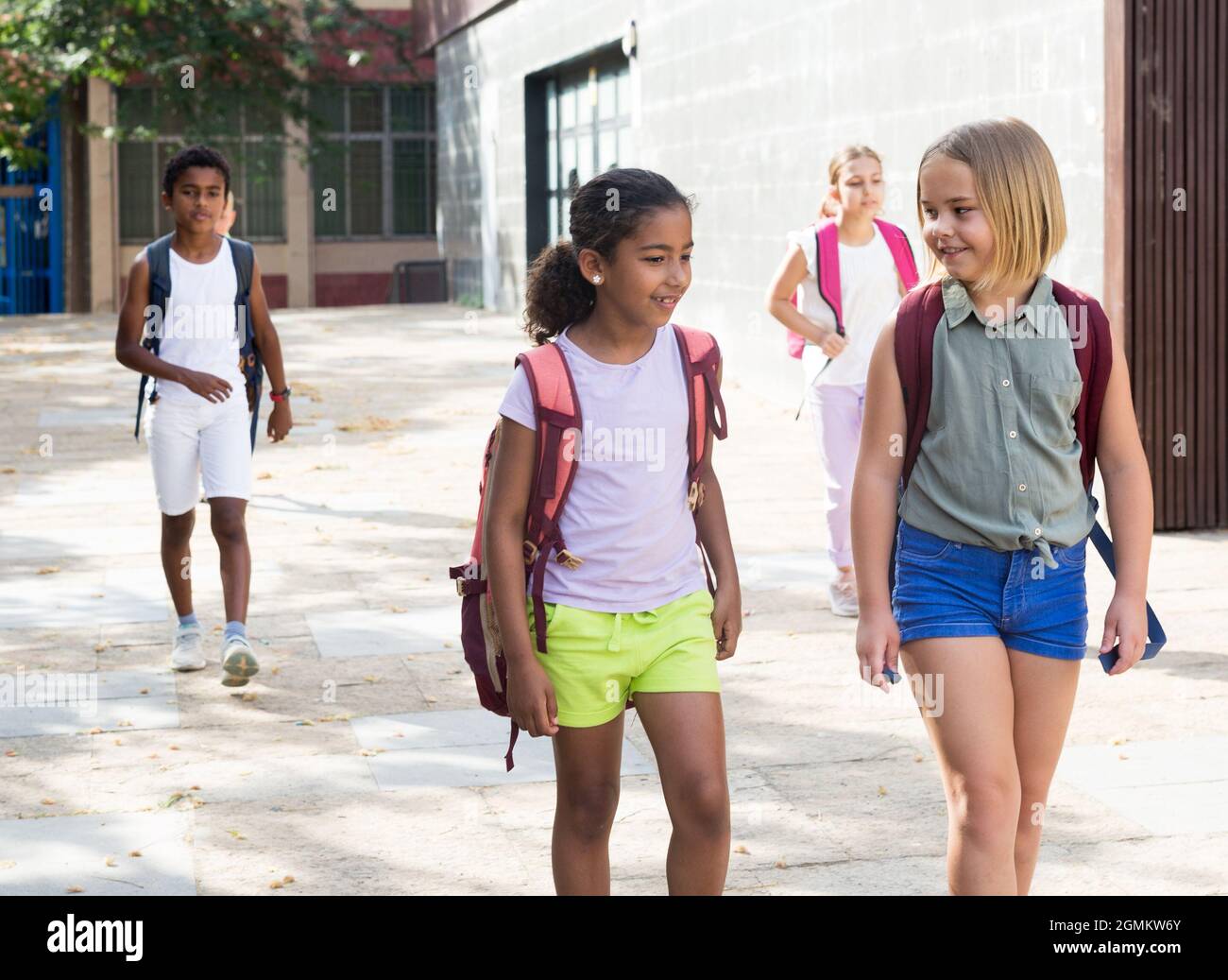 Schoolgirls walking together Stock Photo - Alamy