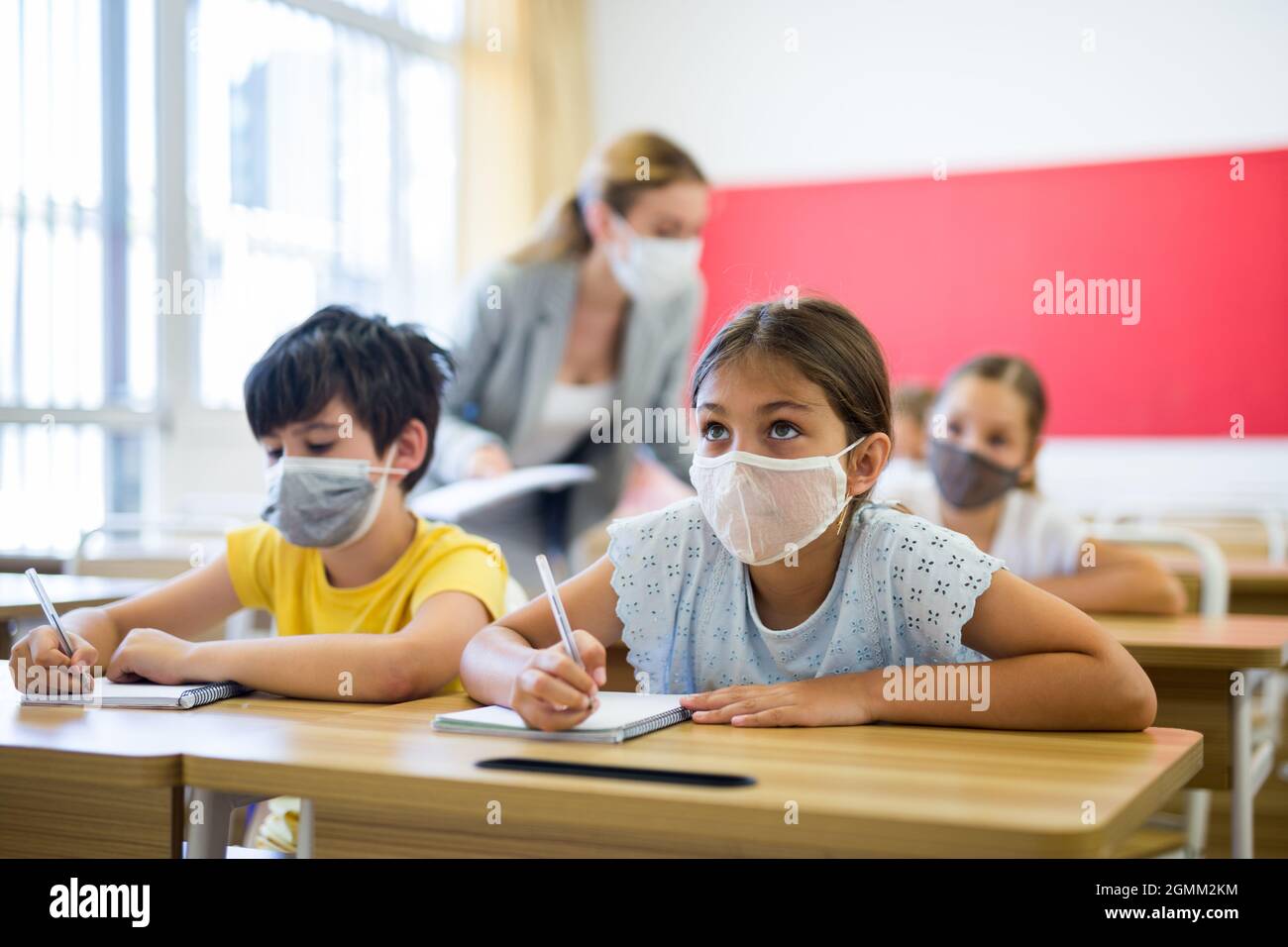 Kids sitting in classroom Stock Photo - Alamy