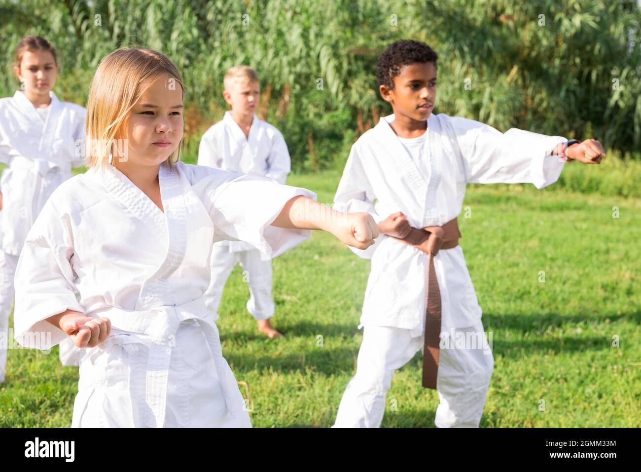 Kids in kimono doing kata moves Stock Photo - Alamy